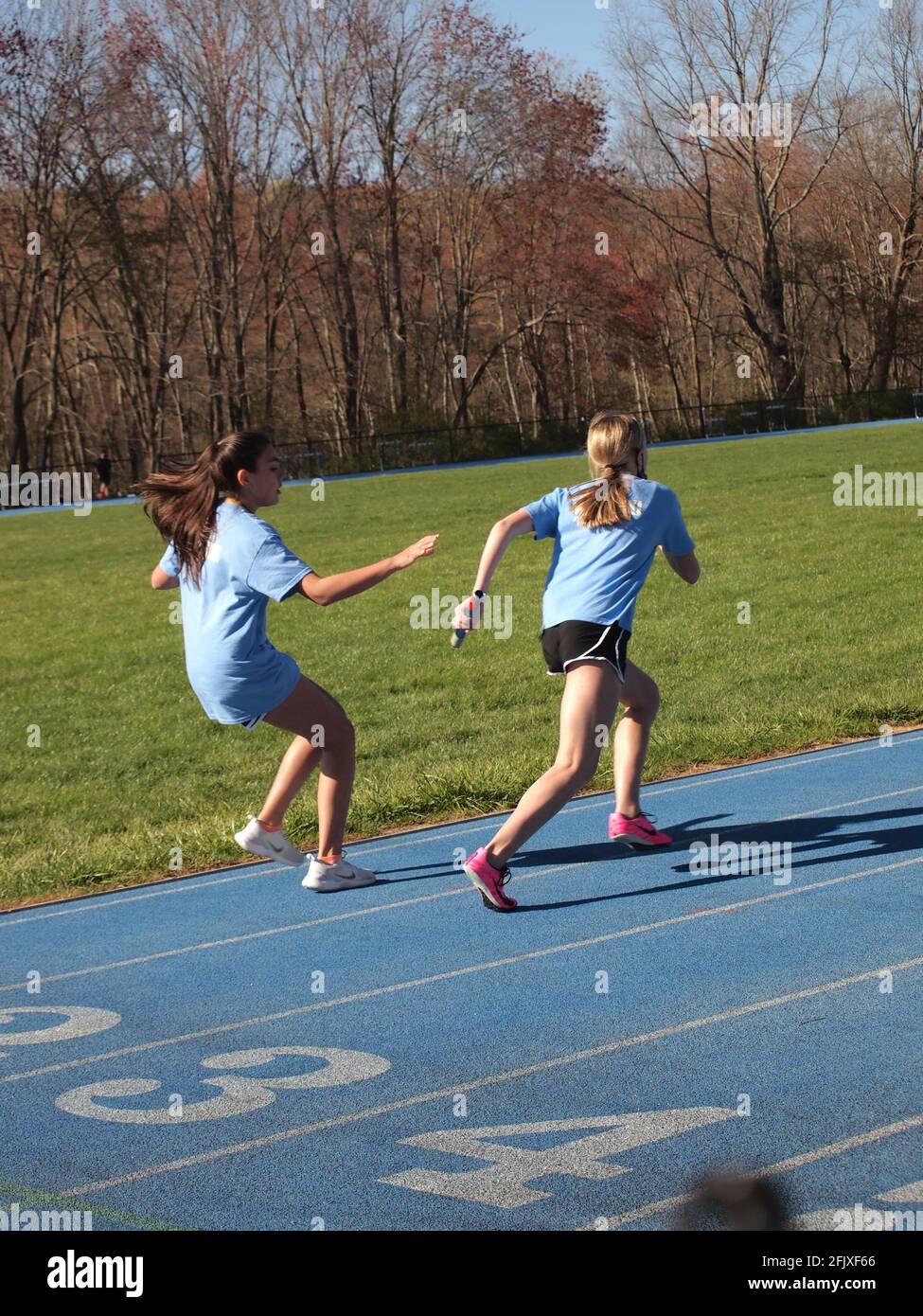 Young girls participating in a Middle school track meet in Sussex ...