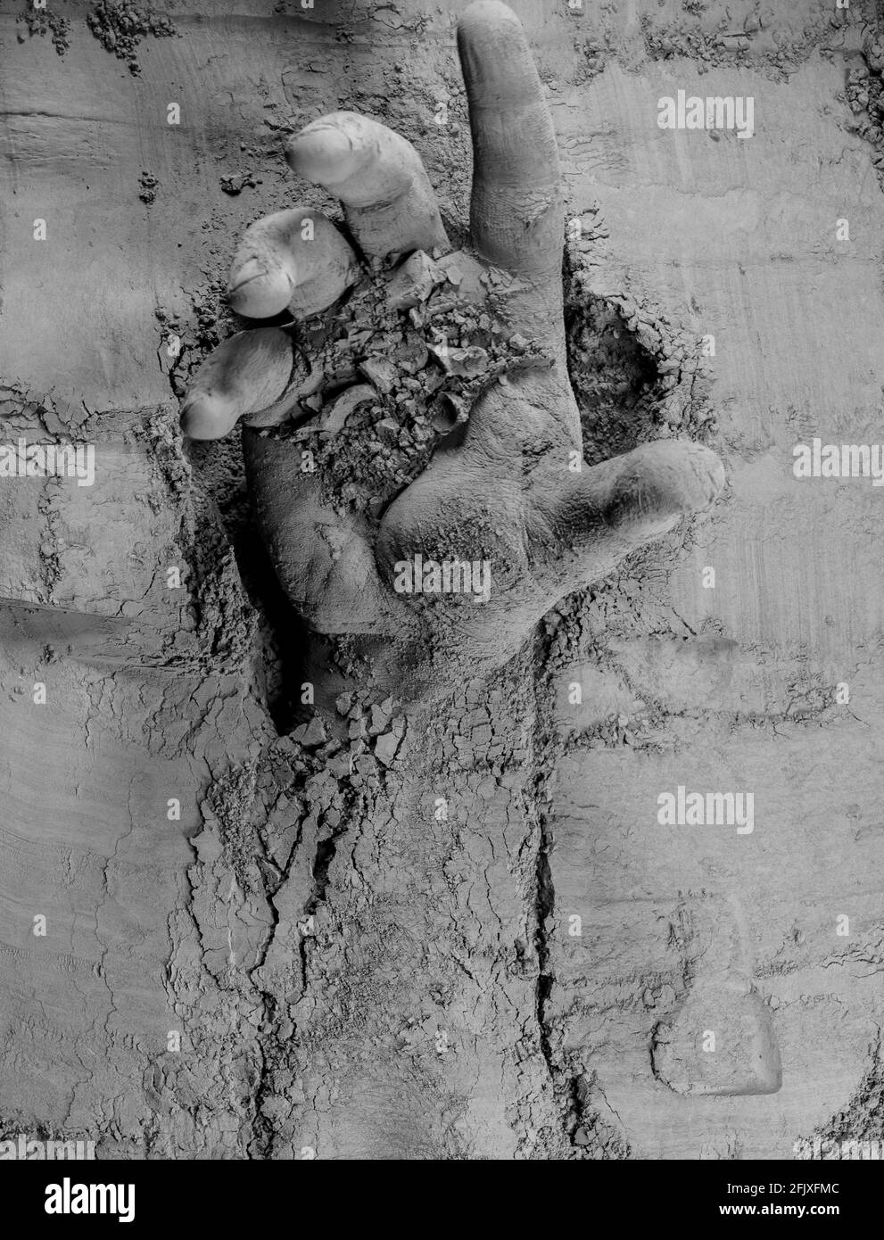 Human hand rising up and reaching from cement. Human power and Labor ...