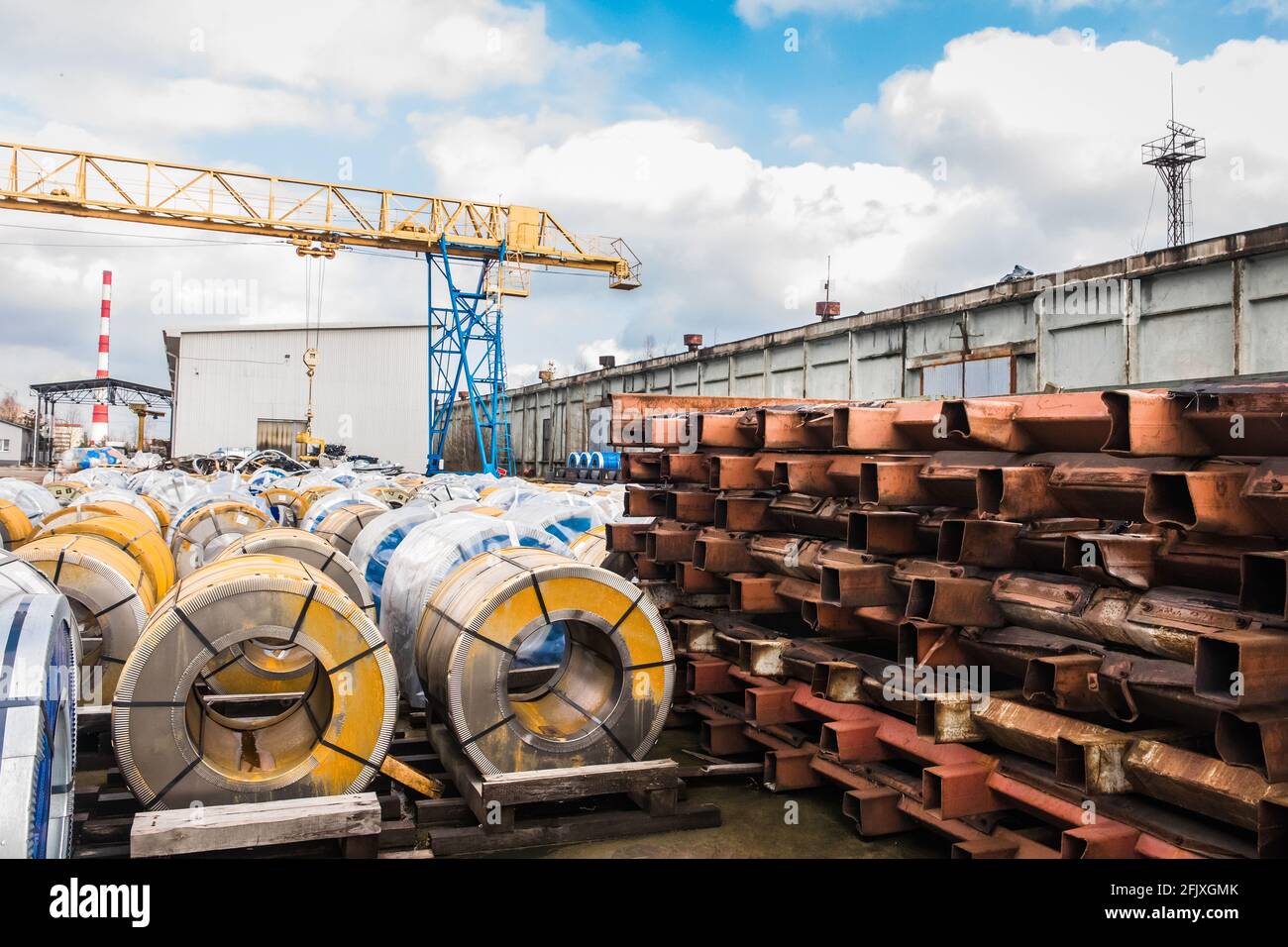 Storage of old rusty metal materials in an open industrial area near a ...