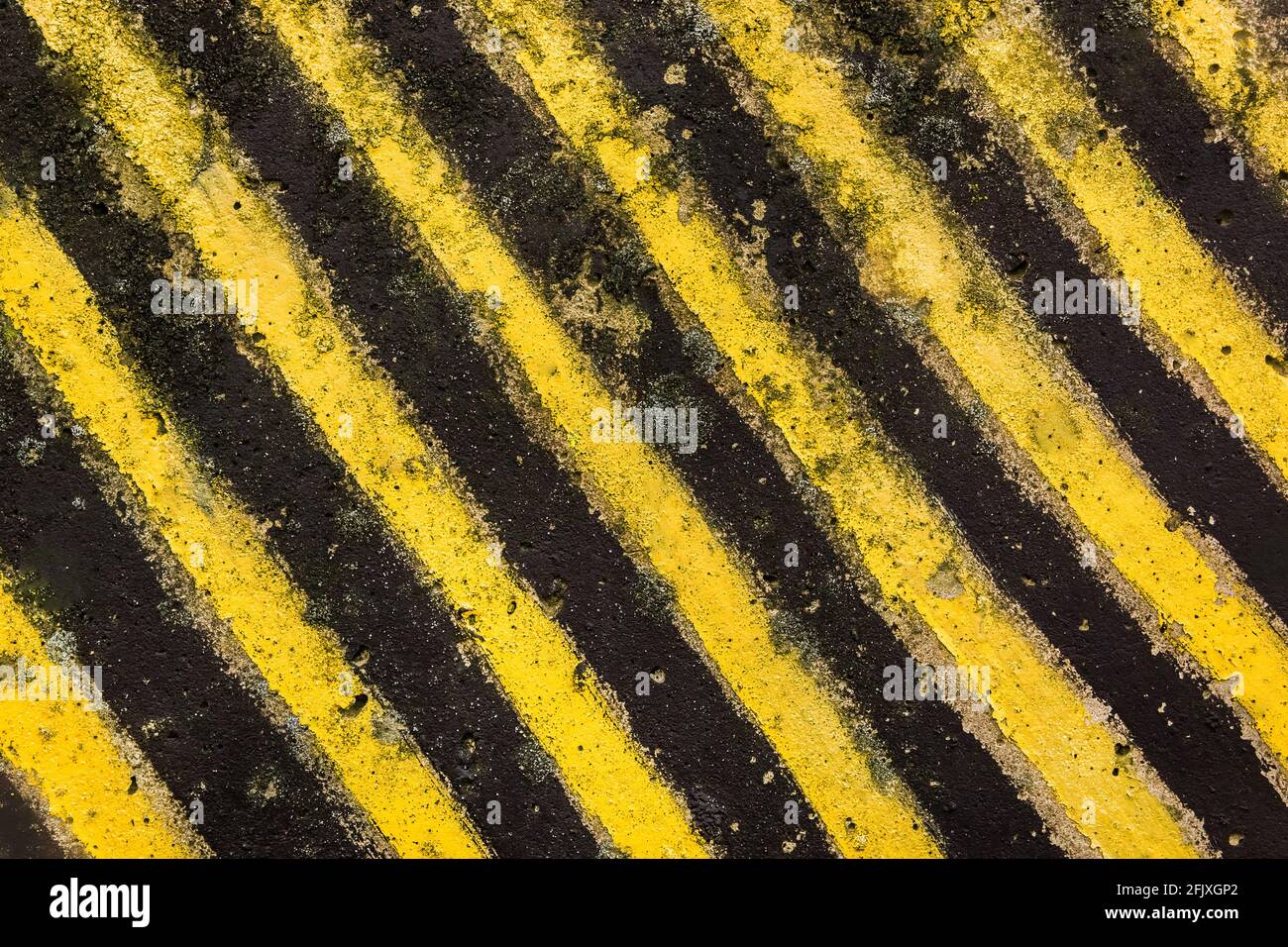 Hazardous restricted area designation, black and yellow diagonal lines ...