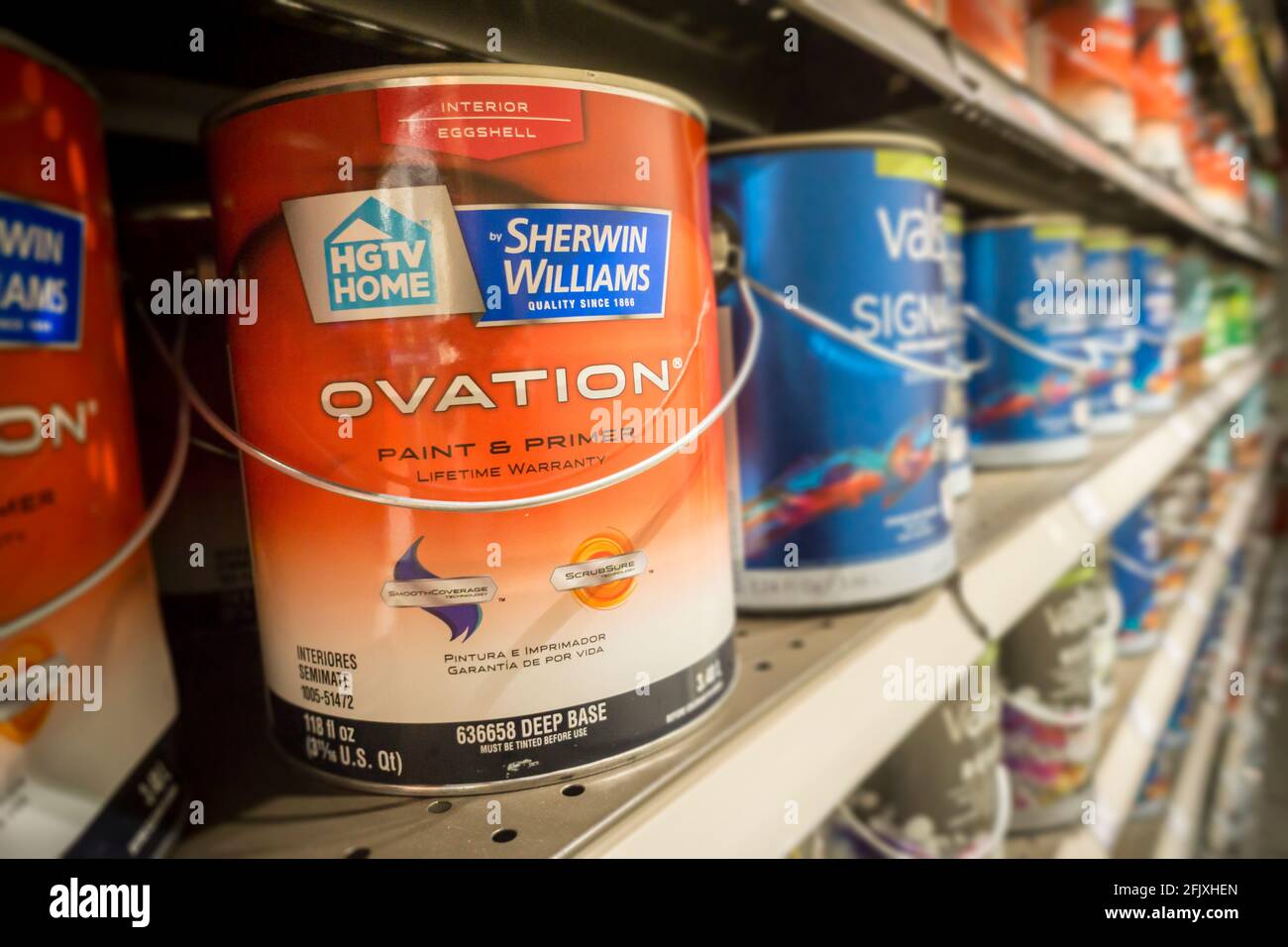 Cans of Valspar and HGTV by Sherwin-Williams brand paint are seen in a ...