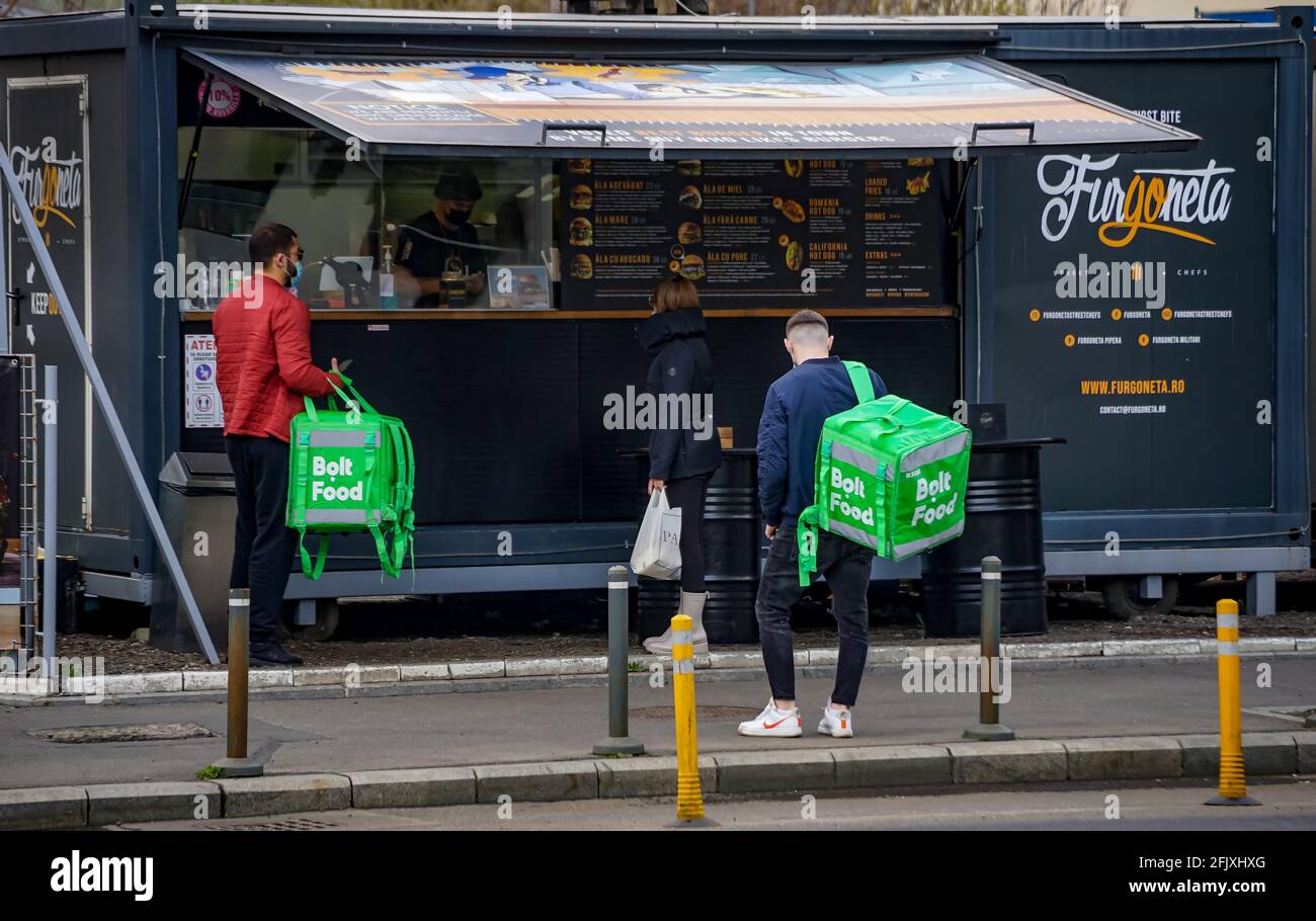 Bucharest, Romania - April 05, 2021: Bolt Food delivery couriers queue ...