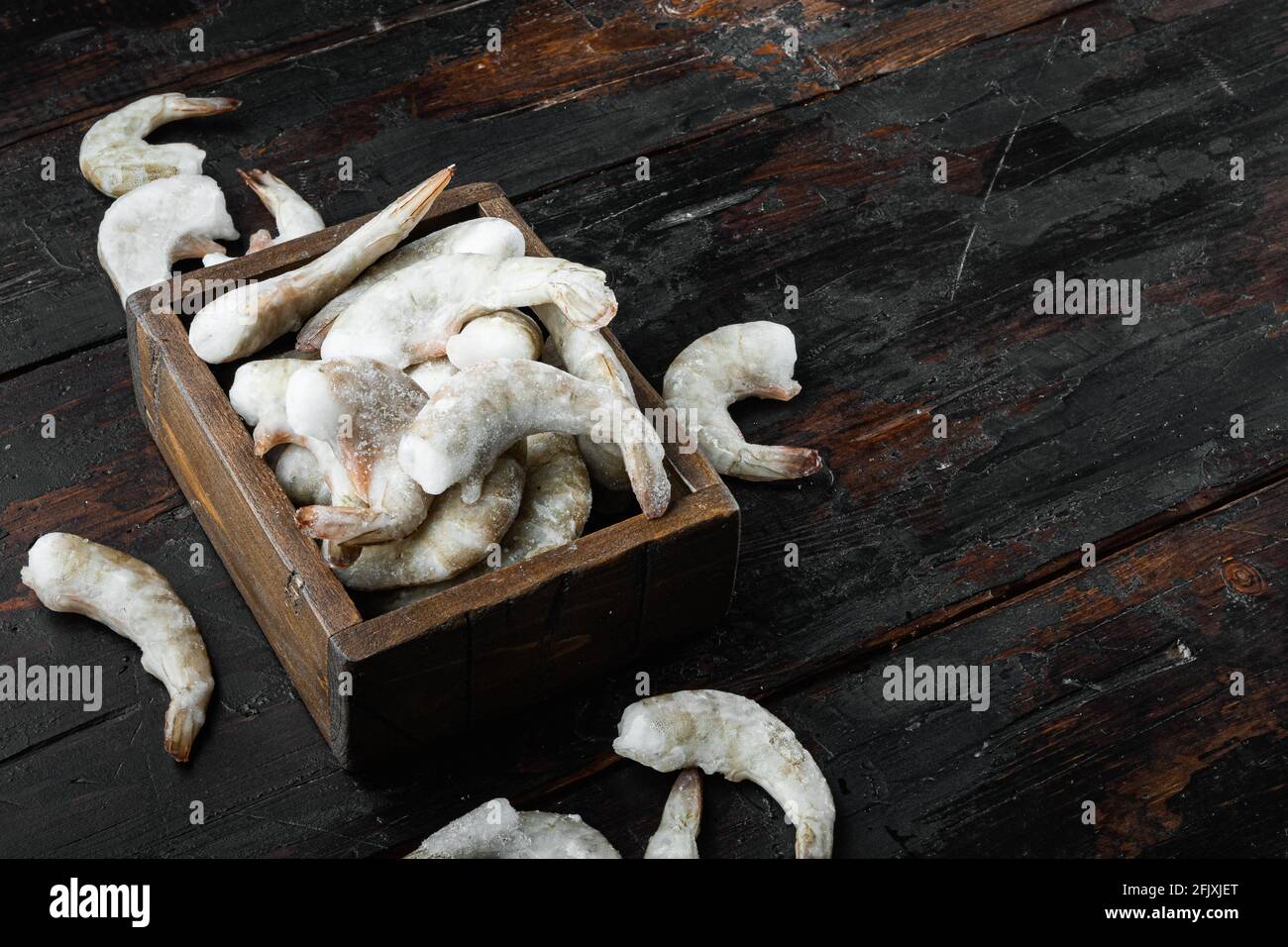 Frozen shell on Tiger Prawns or Asian tiger Shrimps set, on old dark ...