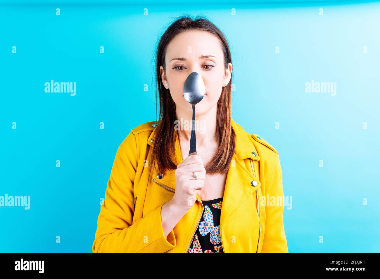 Girl spoon on nose hi-res stock photography and images - Alamy