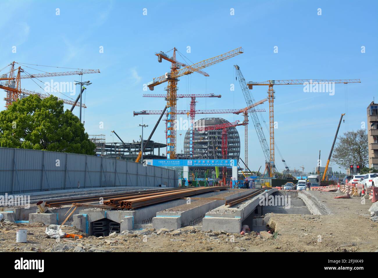 Large cranes constructing buildings at the new Jiaxing north railway ...