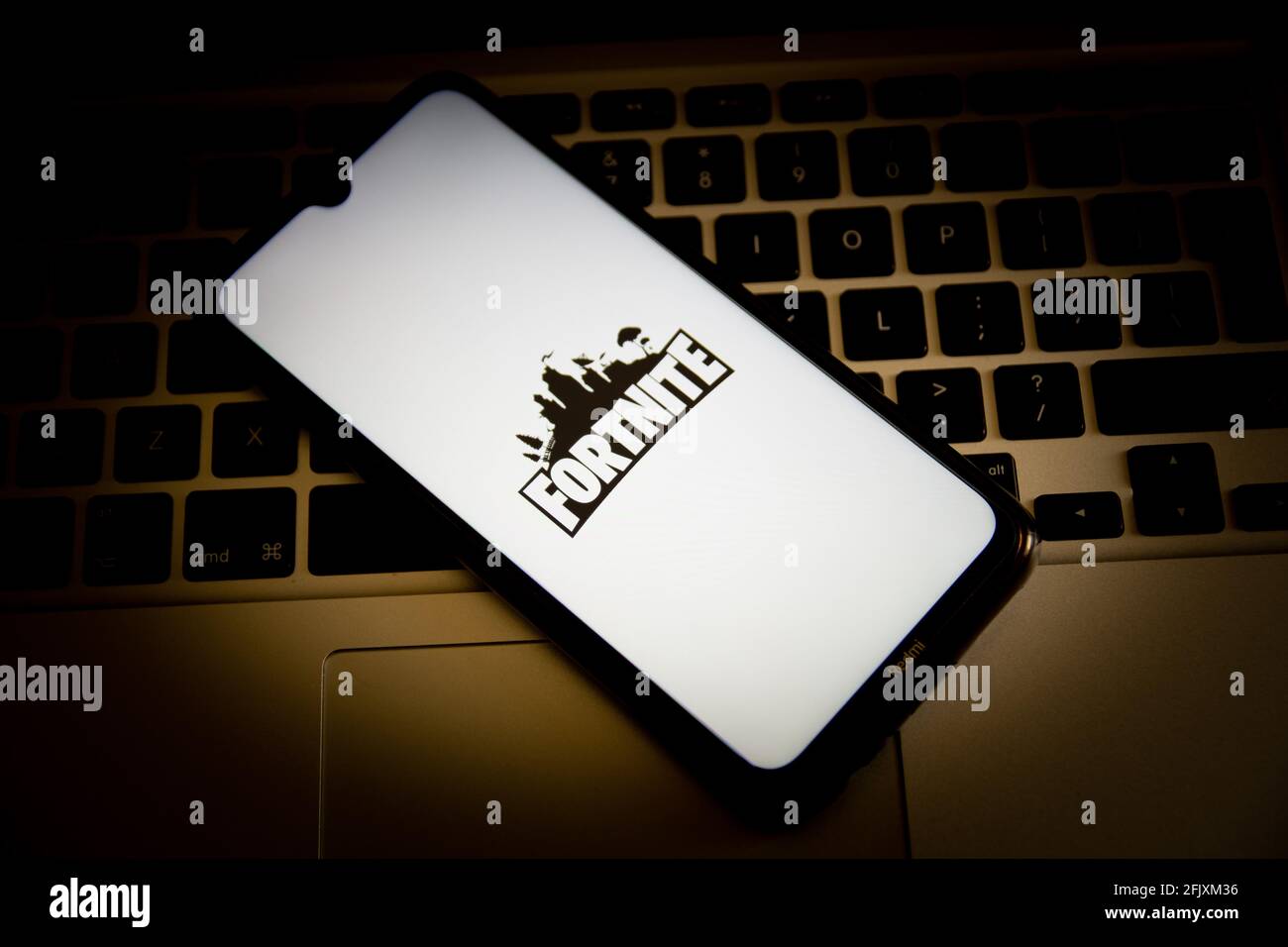 In this photo illustration, a Fortnite logo seen displayed on a ...