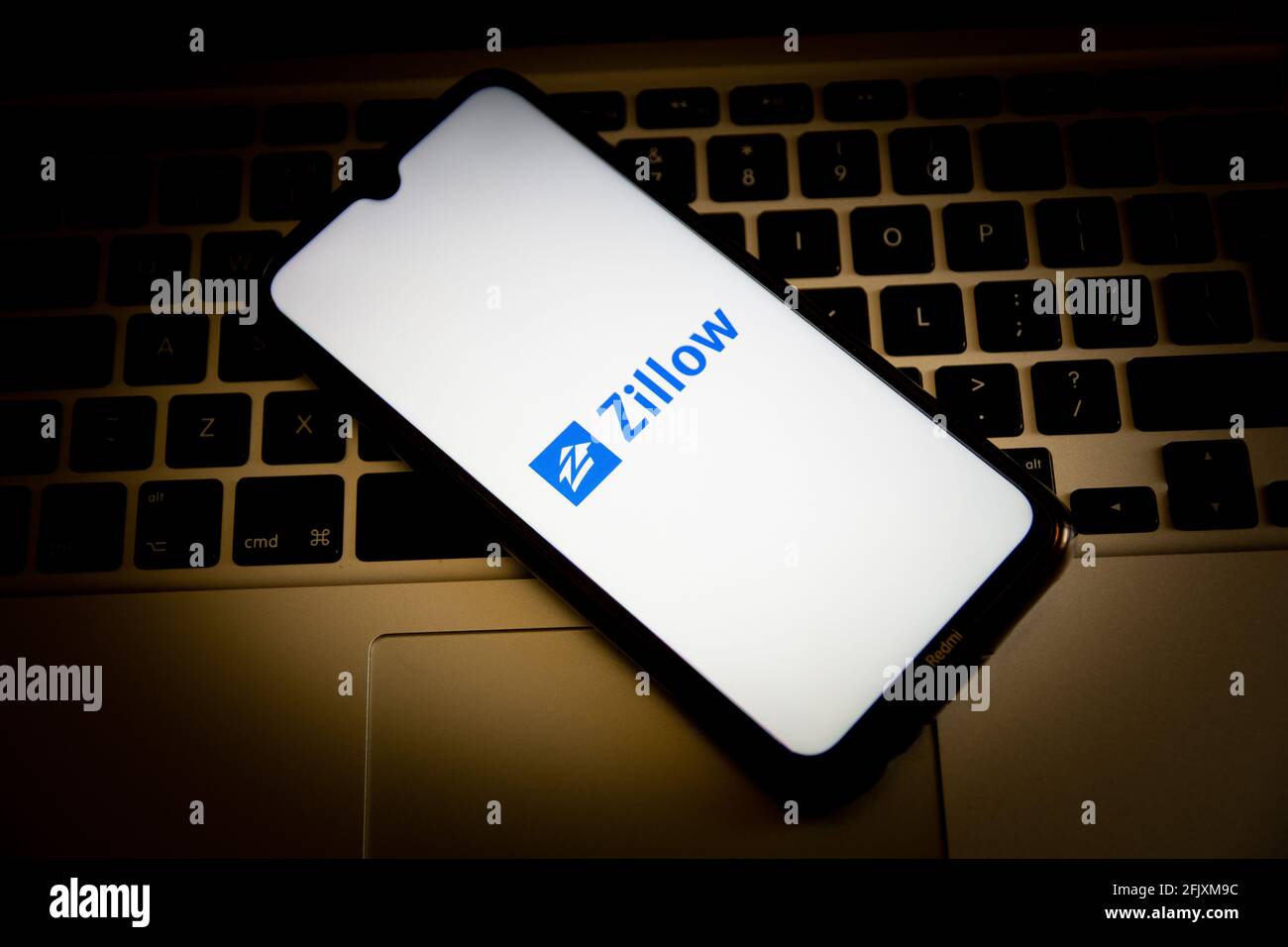 In this photo illustration, a Rolex logo seen displayed on a smartphone ...