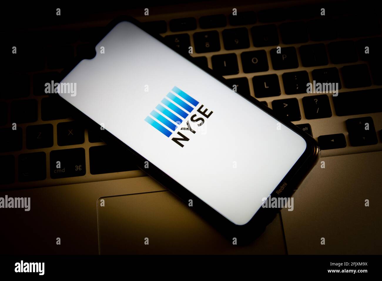 In this photo illustration, a NYSE (New York Stock Exchange) logo seen ...