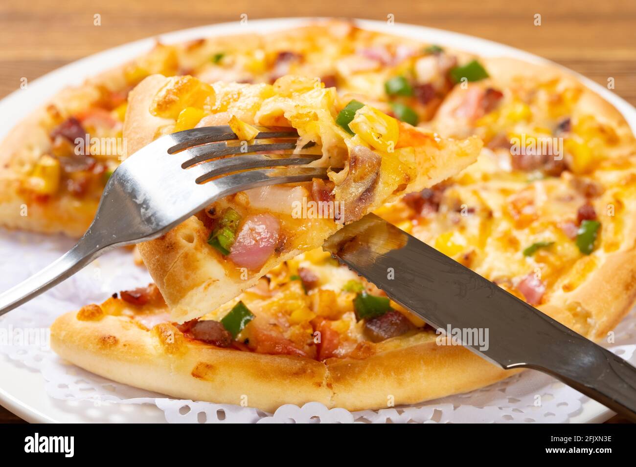 angle view eating fresh pizza with BBQ pork toppings Stock Photo - Alamy