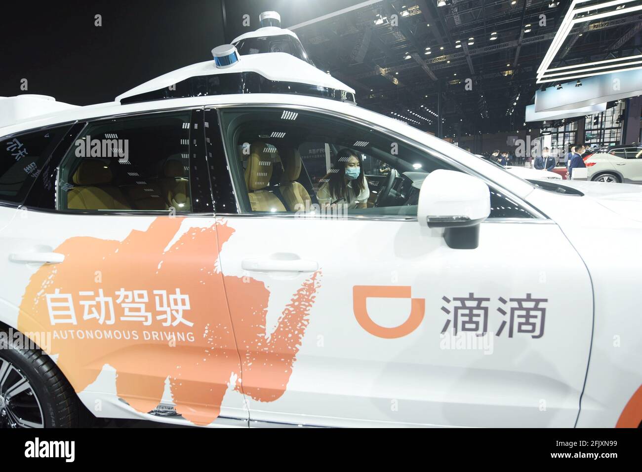 SHANGHAI, CHINA - APRIL 19, 2021 - Visitors look at a driverless car ...