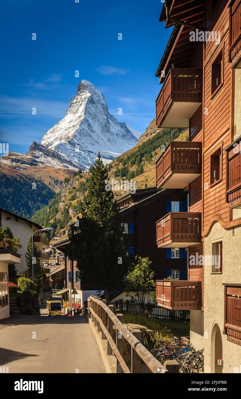 A street in the Swiss resort town of Zermatt with a view of Matterhorn ...