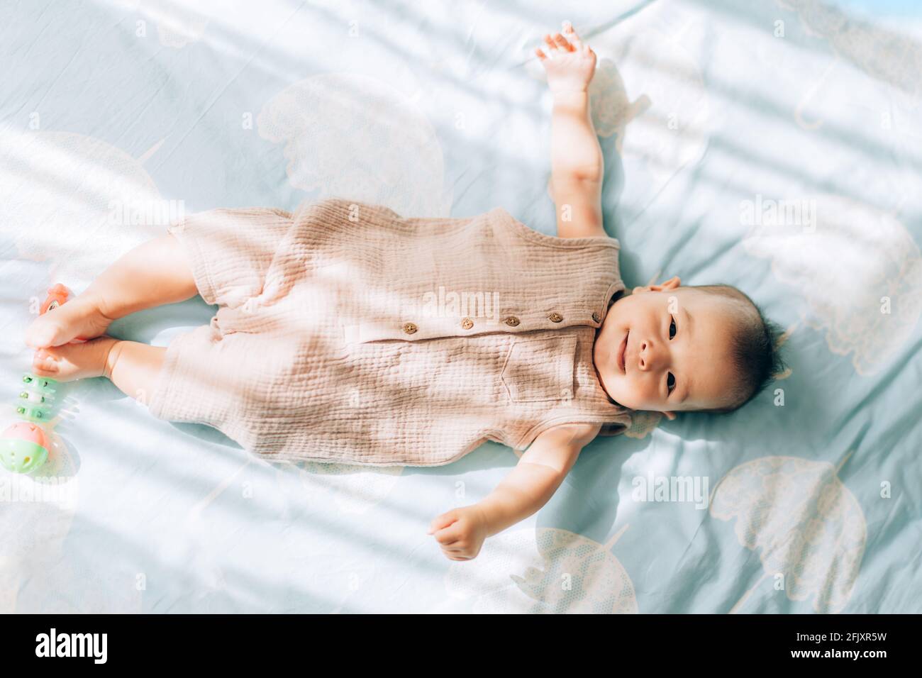 Child adoption and In Vitro Fertilization IVF . Asian child lying on ...