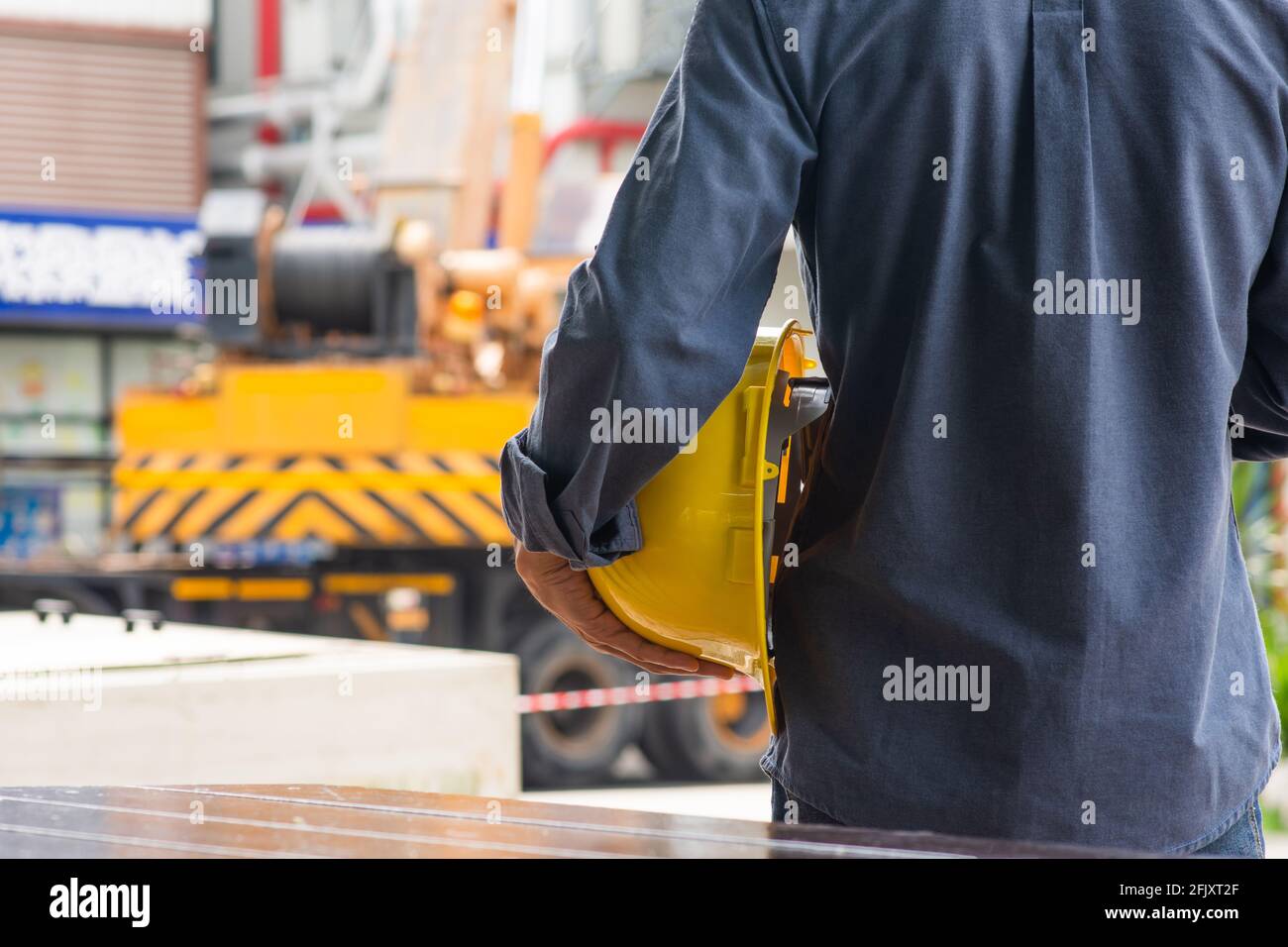 Engineer worker holding yellow helmet hard hat safety car truck ...