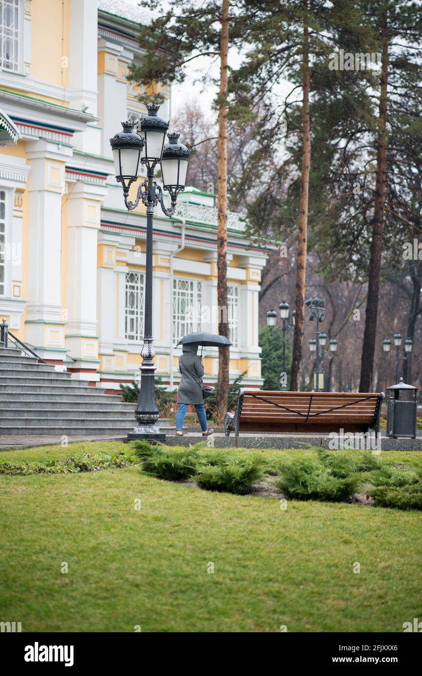 church and lawn with bench in city park in spring Stock Photo - Alamy