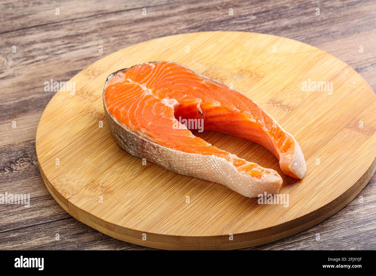 Raw salmon steak over board for cooking Stock Photo - Alamy
