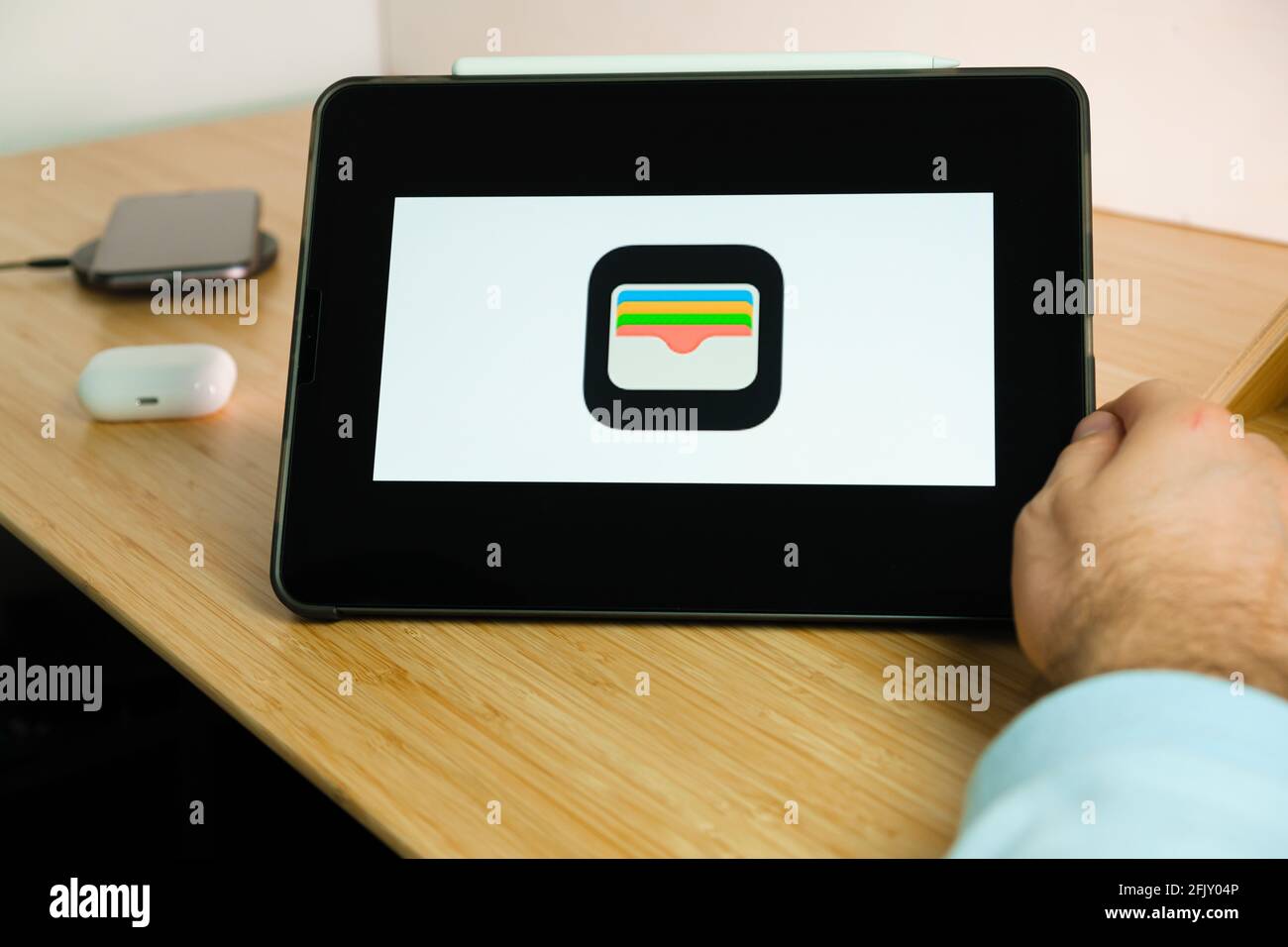Apple wallet logo on the screen of iPad tablet. March 2021, San ...