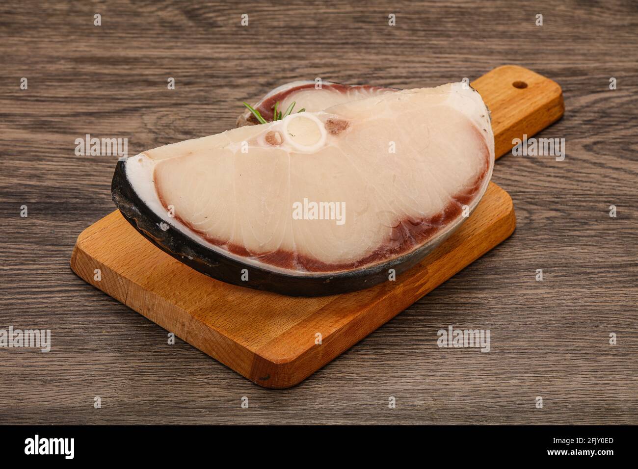 Raw shark steak served rosemary for cooking Stock Photo - Alamy