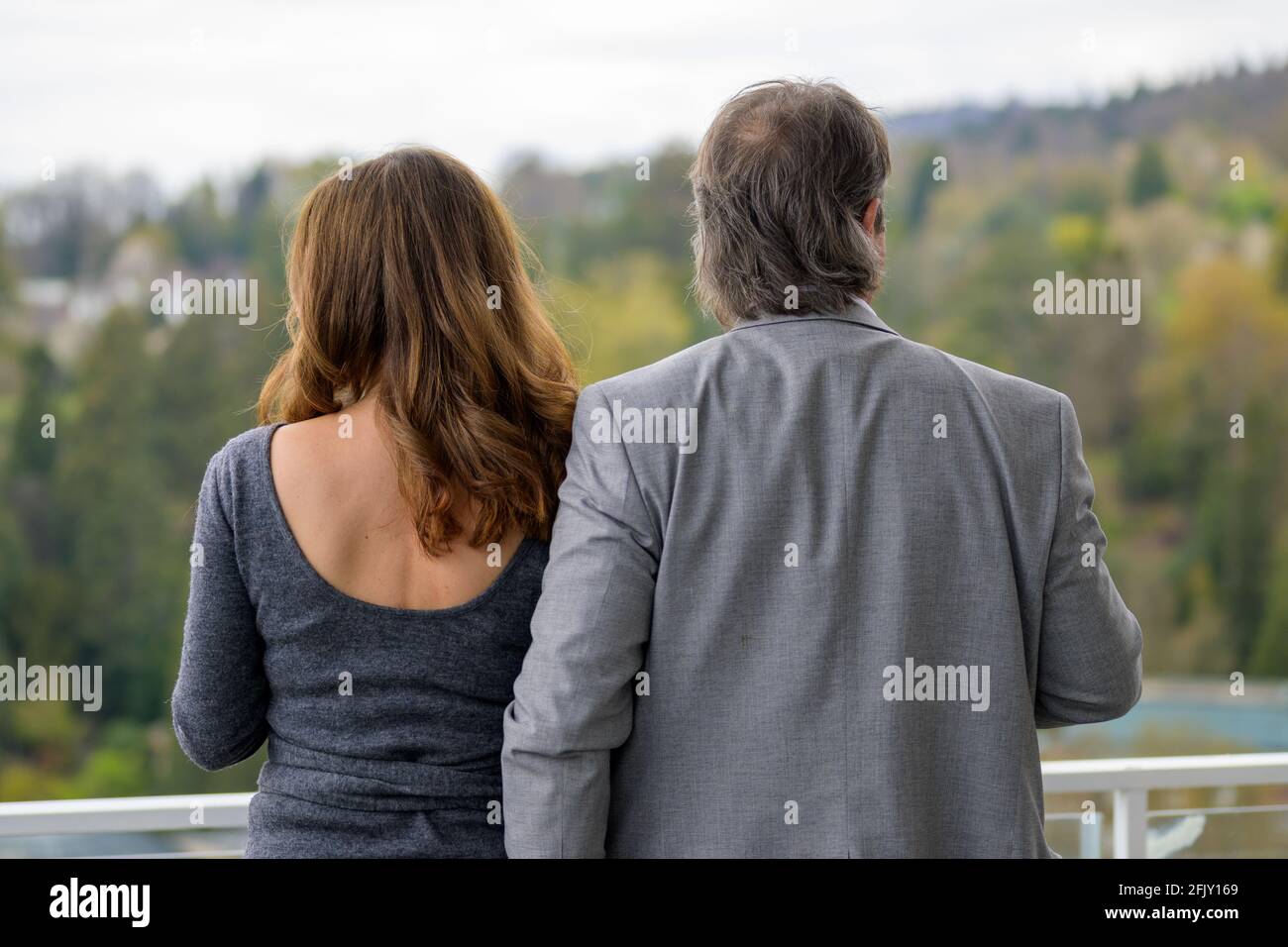 Standing looking out balcony hi-res stock photography and images - Alamy