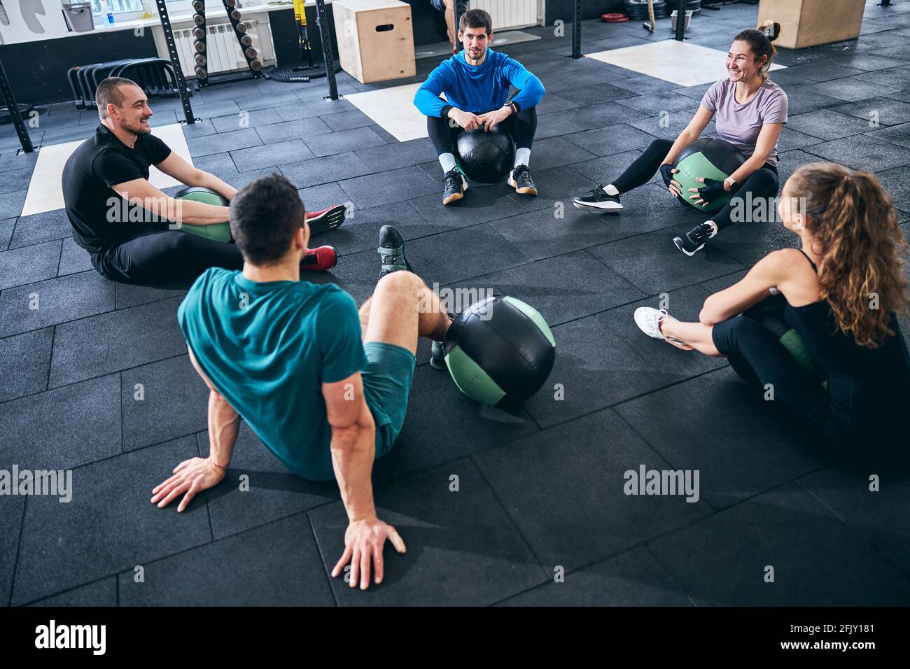 Team of athletes resting after the workout Stock Photo - Alamy
