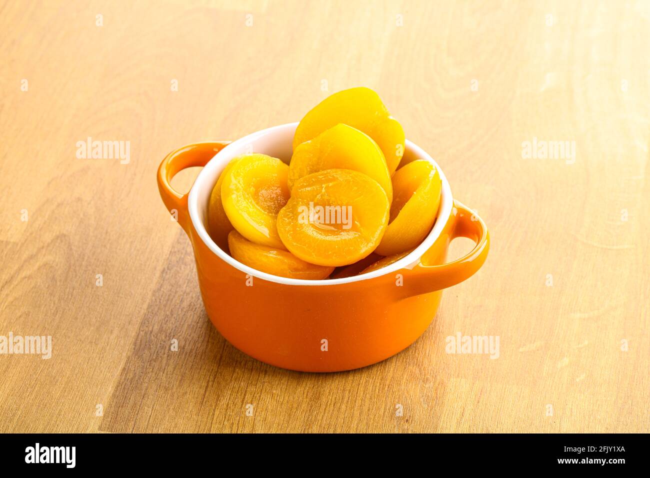 Canned apricot – sweet light dessert in the bowl Stock Photo - Alamy