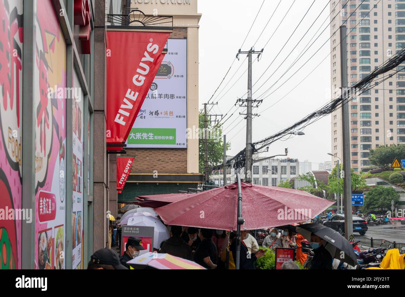 SHANGHAI, CHINA - APRIL 27, 2021 - Diners line up in front of the US ...