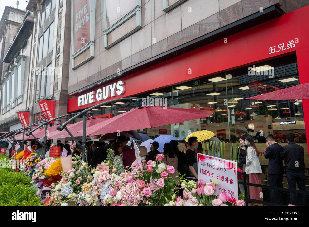 SHANGHAI, CHINA - APRIL 27, 2021 - Diners line up in front of the US ...