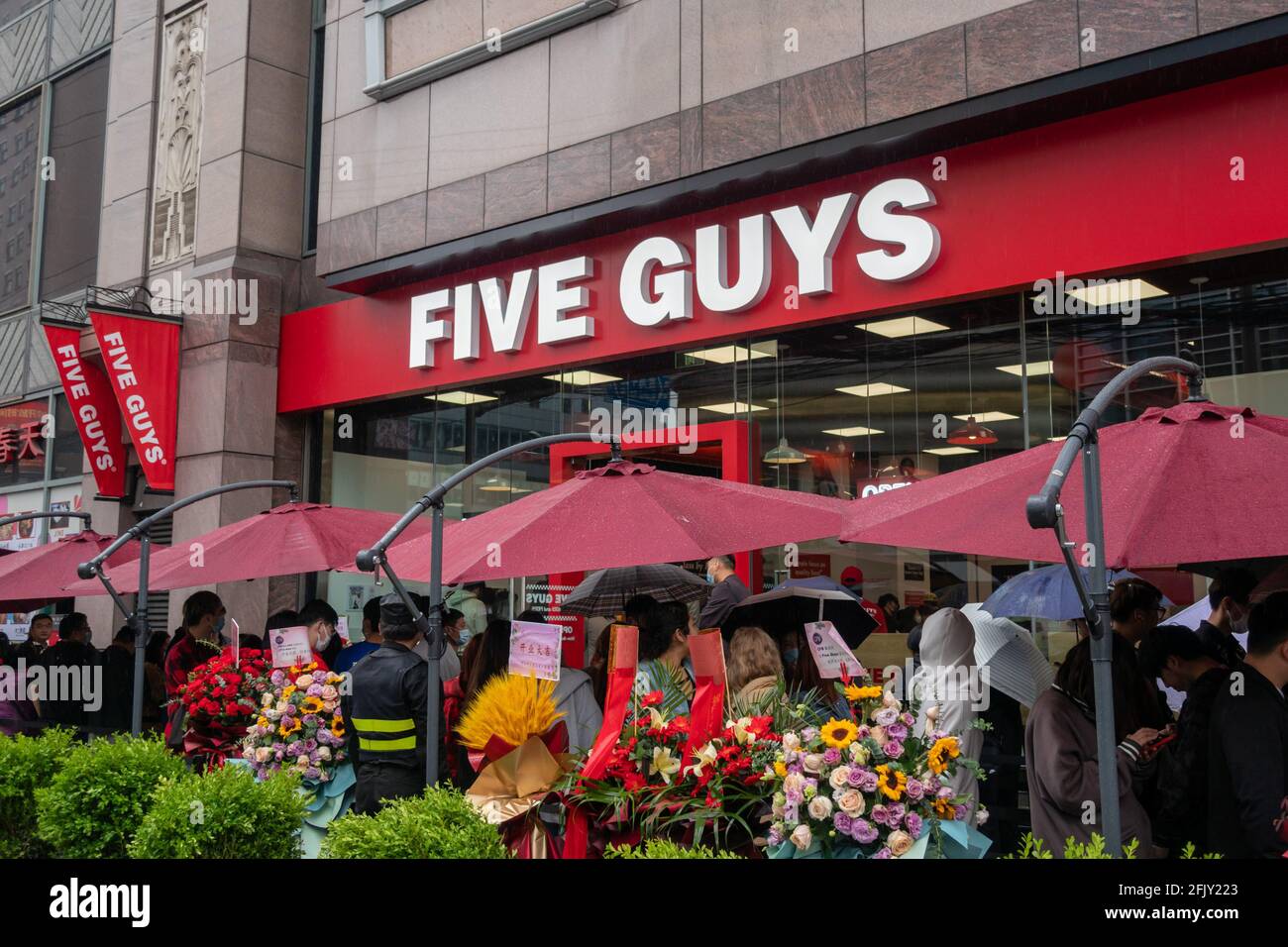 SHANGHAI, CHINA - APRIL 27, 2021 - Diners line up in front of the US ...