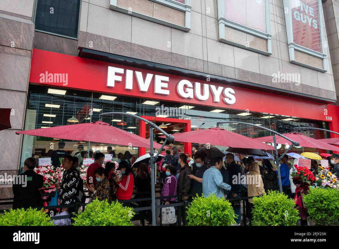 SHANGHAI, CHINA - APRIL 27, 2021 - Diners line up in front of the US ...