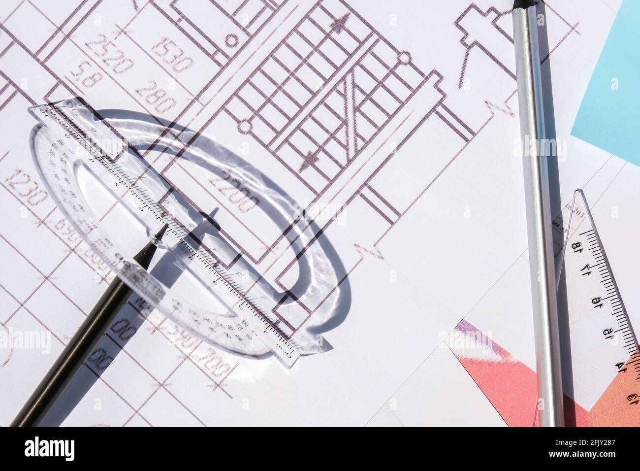 A pencil with a protractor. Architectural Project drawings with tools ...