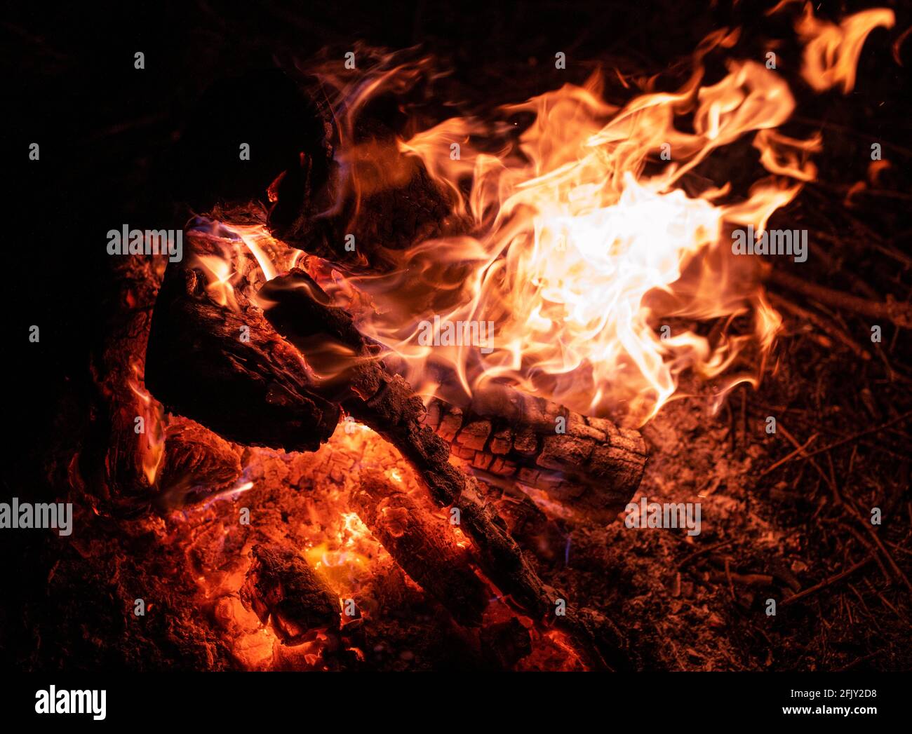 Beautiful camping fire burning outdoors with lots of glowing embers ...
