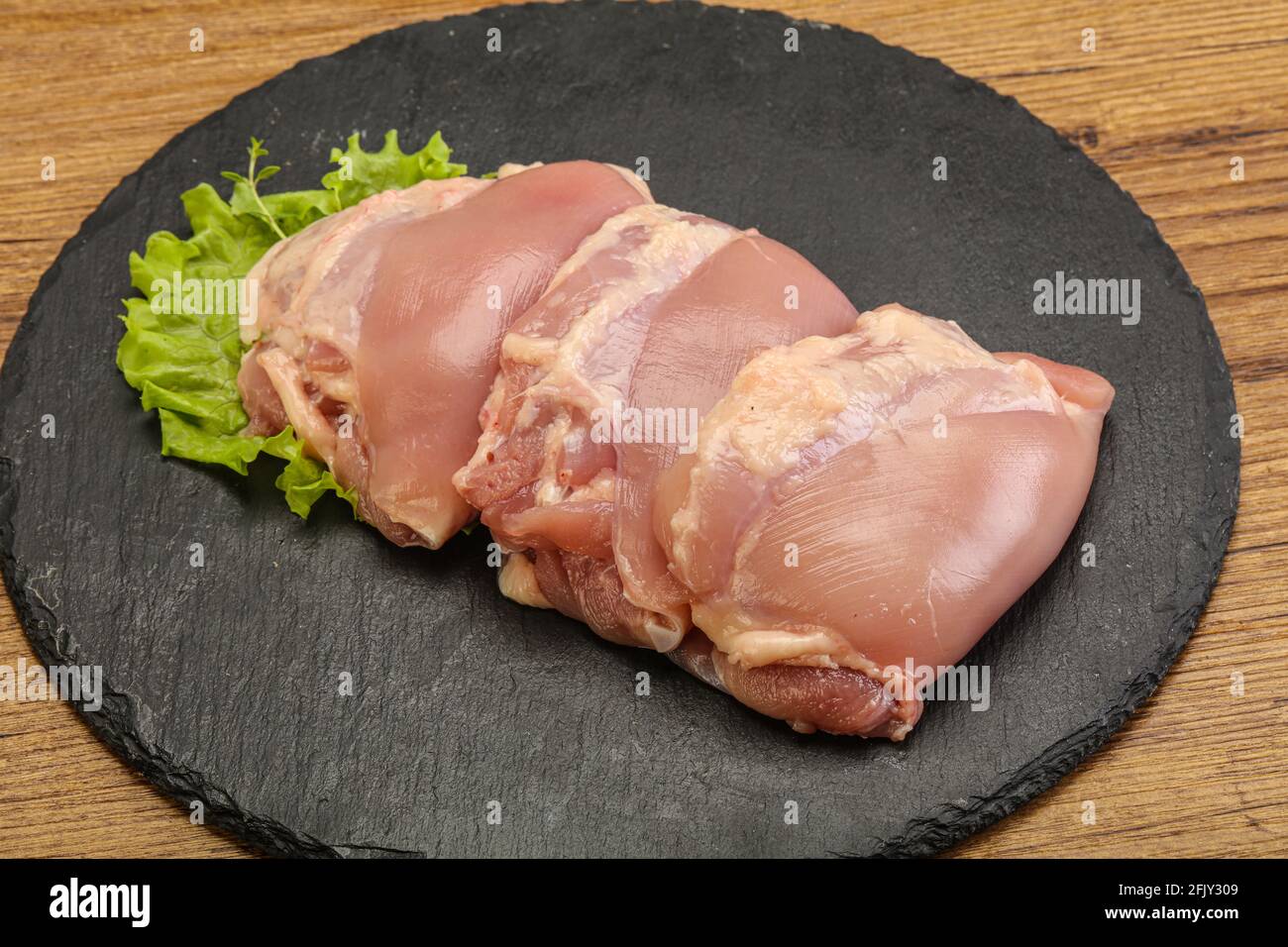 Raw chicken boneless and skinless leg for cooking Stock Photo - Alamy