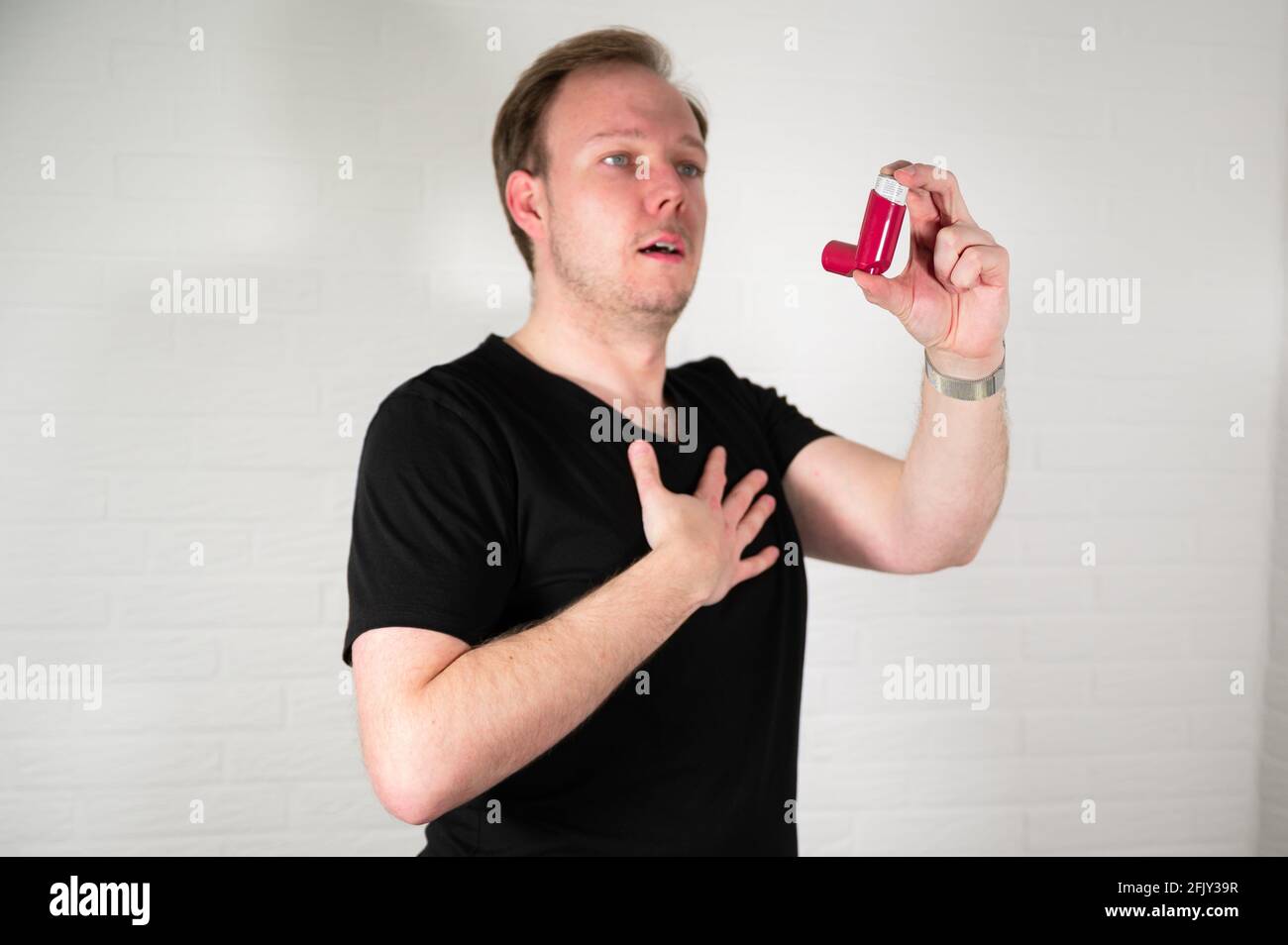 Man using an asthma spray inhaler Stock Photo - Alamy