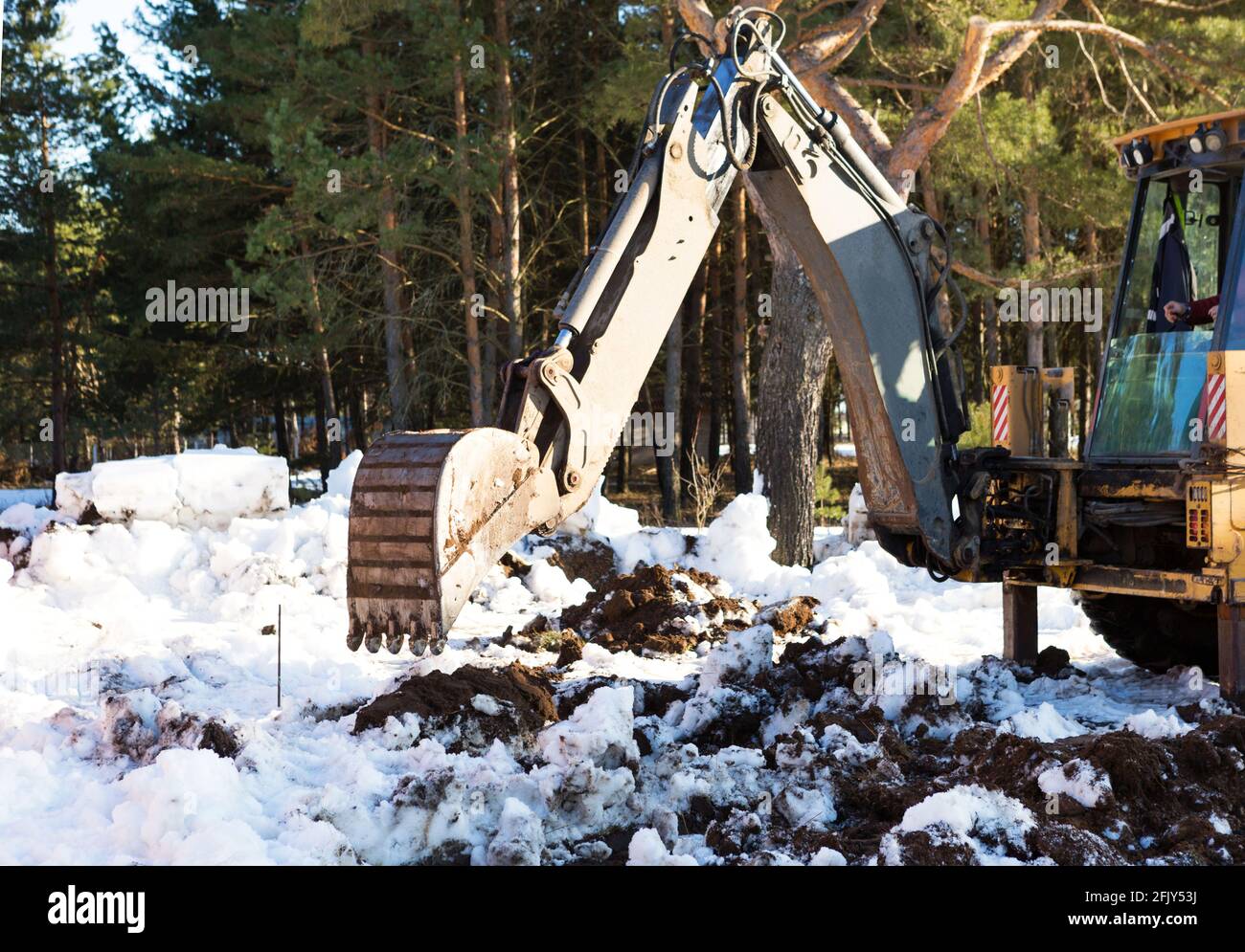 Bulldozer bucket close-up digs a pit for the construction. The ...