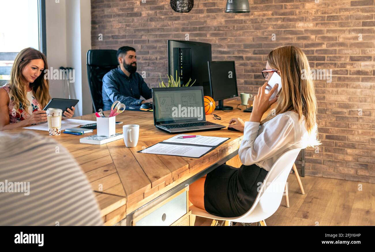 People working in a coworking office Stock Photo - Alamy