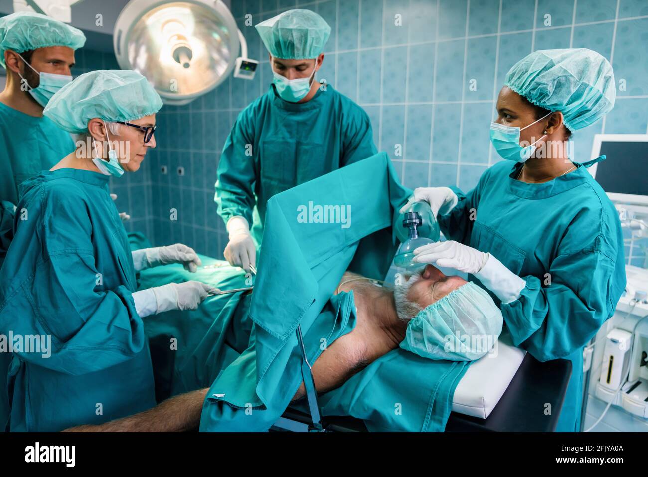 Group of surgeon team at work in operating room in hospital Stock Photo ...