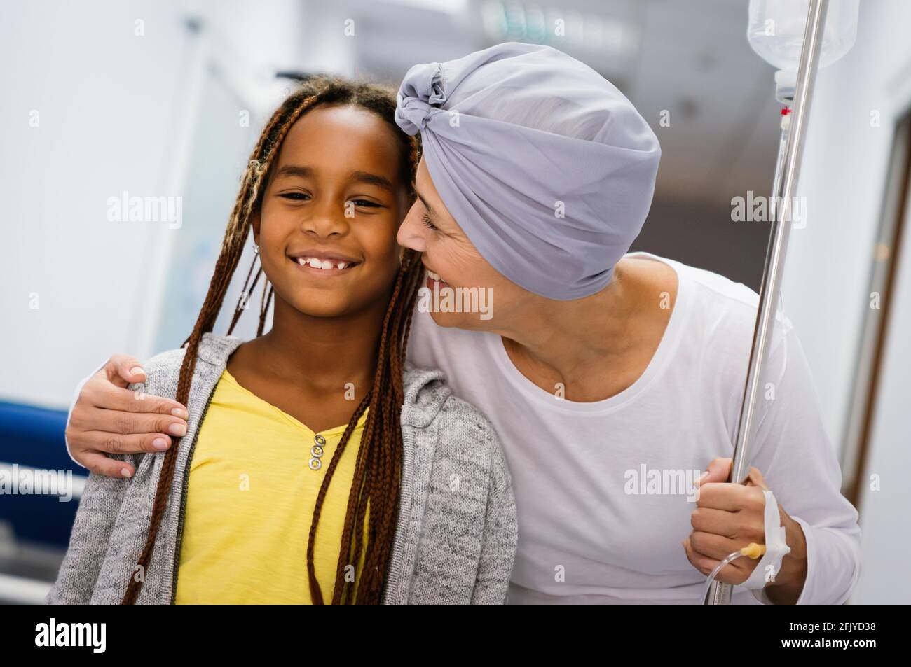 Senior woman fighting with cancer with family support. Woman receiving ...