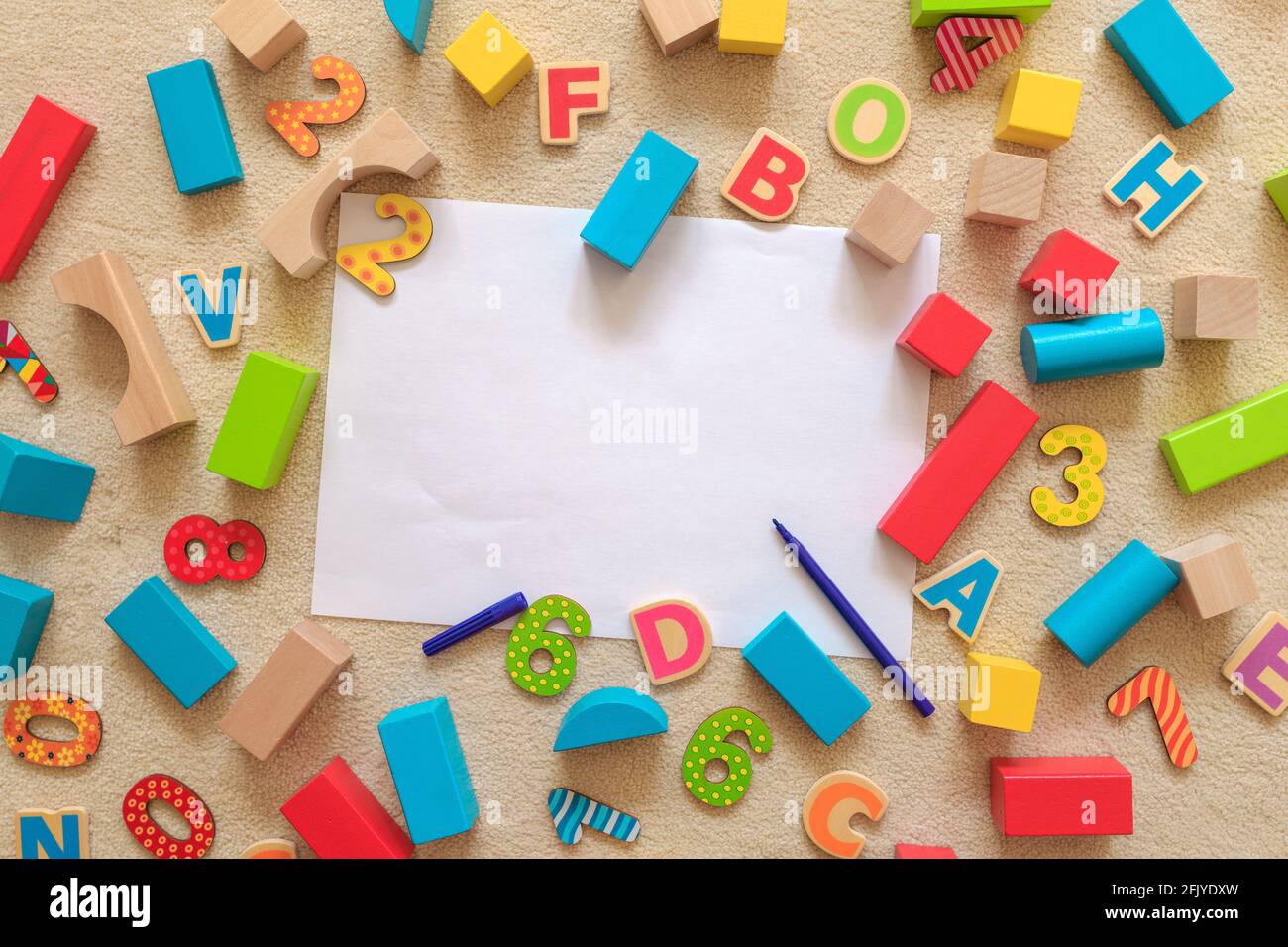 Preschool education concept with flat lay letters and numbers, top view ...