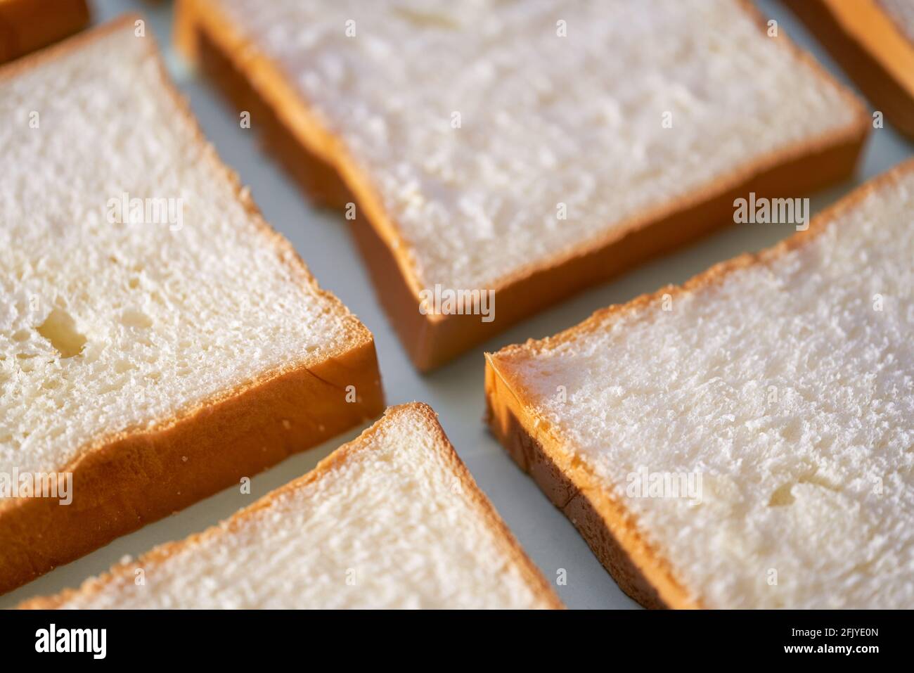 The slices of toast bread filling the picture are spread out on the ...
