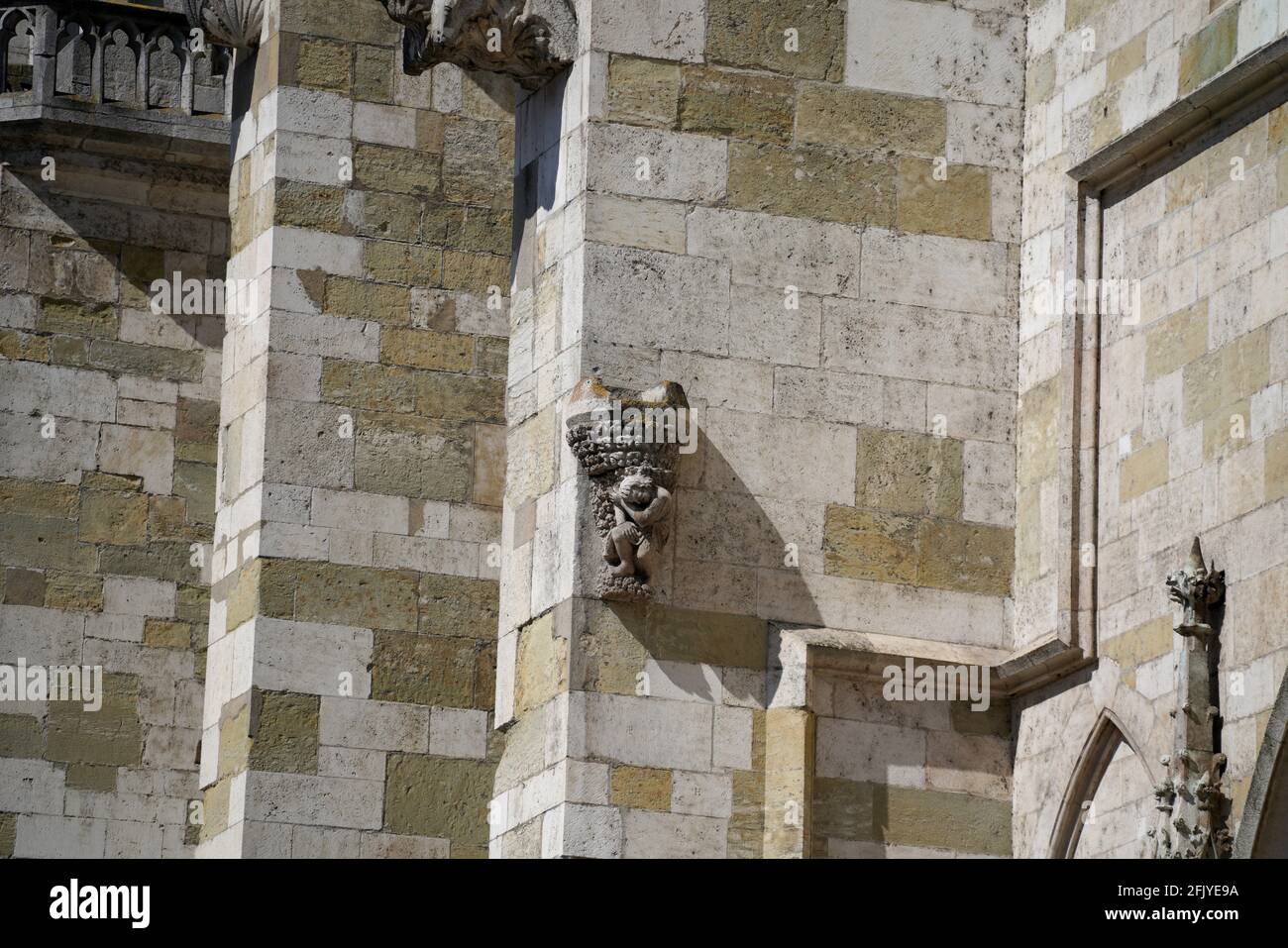 Small gothic sculpture on a medieval building in sunshine Stock Photo ...