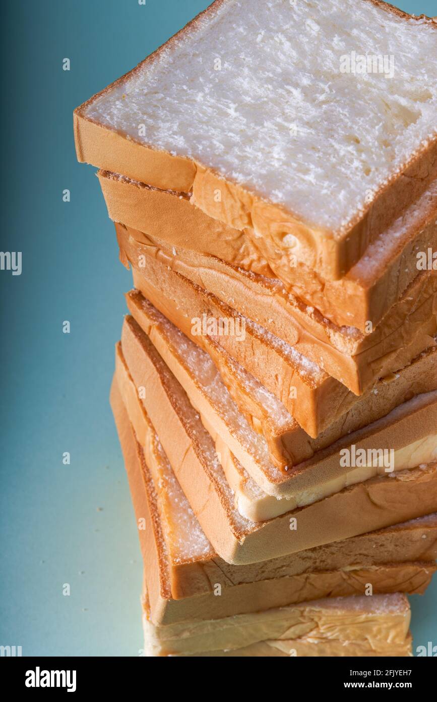 Toast bread slices stacked into towers Stock Photo - Alamy