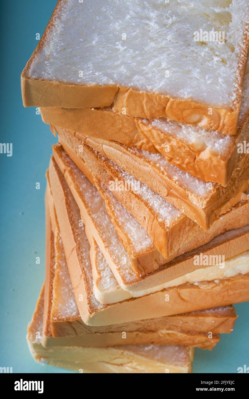Toast bread slices stacked into towers Stock Photo - Alamy