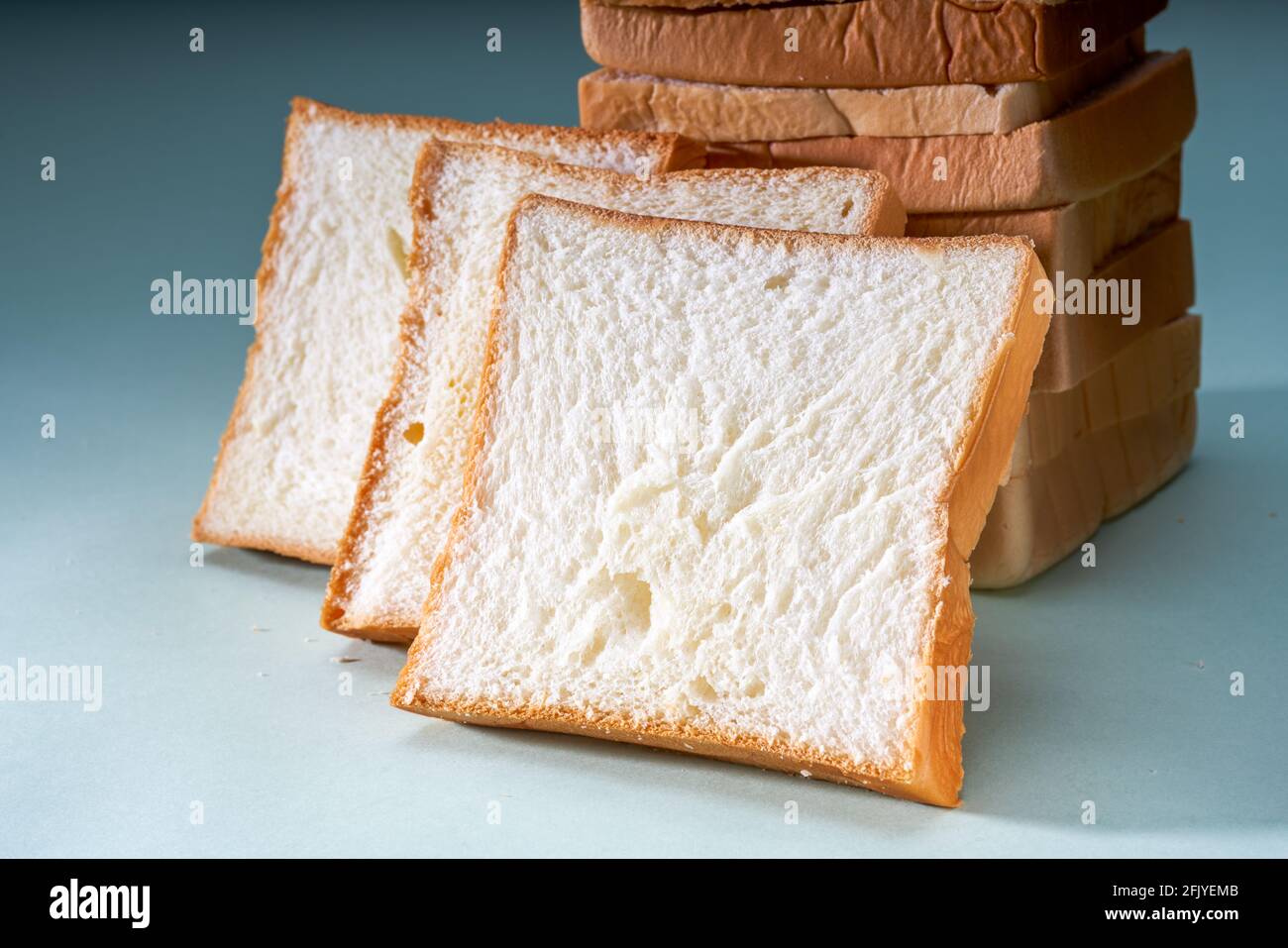 Toast bread slices stacked into towers Stock Photo - Alamy