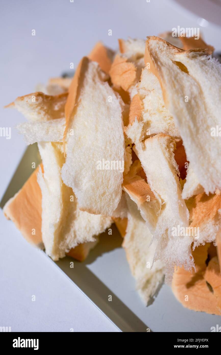 A plate of shredded raw toast bread, shredded toast Stock Photo - Alamy