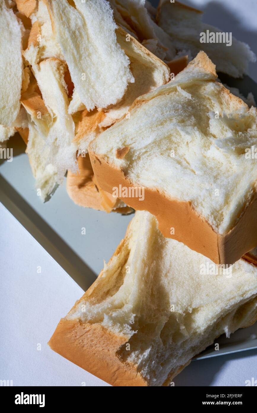 A plate of shredded raw toast bread, shredded toast Stock Photo - Alamy