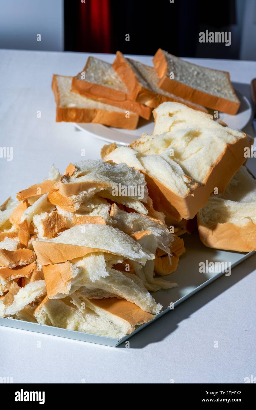 A plate of shredded raw toast bread, shredded toast Stock Photo - Alamy