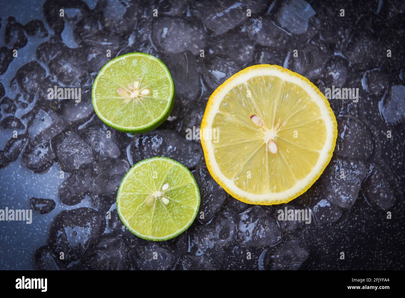 Fresh lemon on ice and dark background, lime lemon slice,top view Stock ...