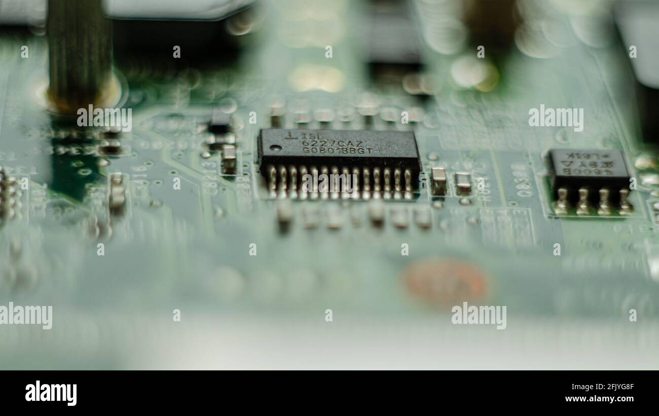 Complex electronics, green circuit board with a microcontroller ...