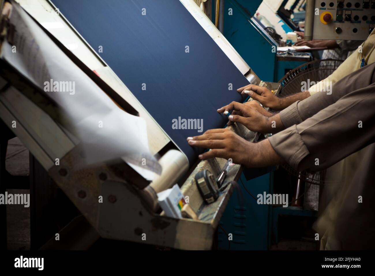 Quality Check for flaws in Quality Control Department in a textile ...