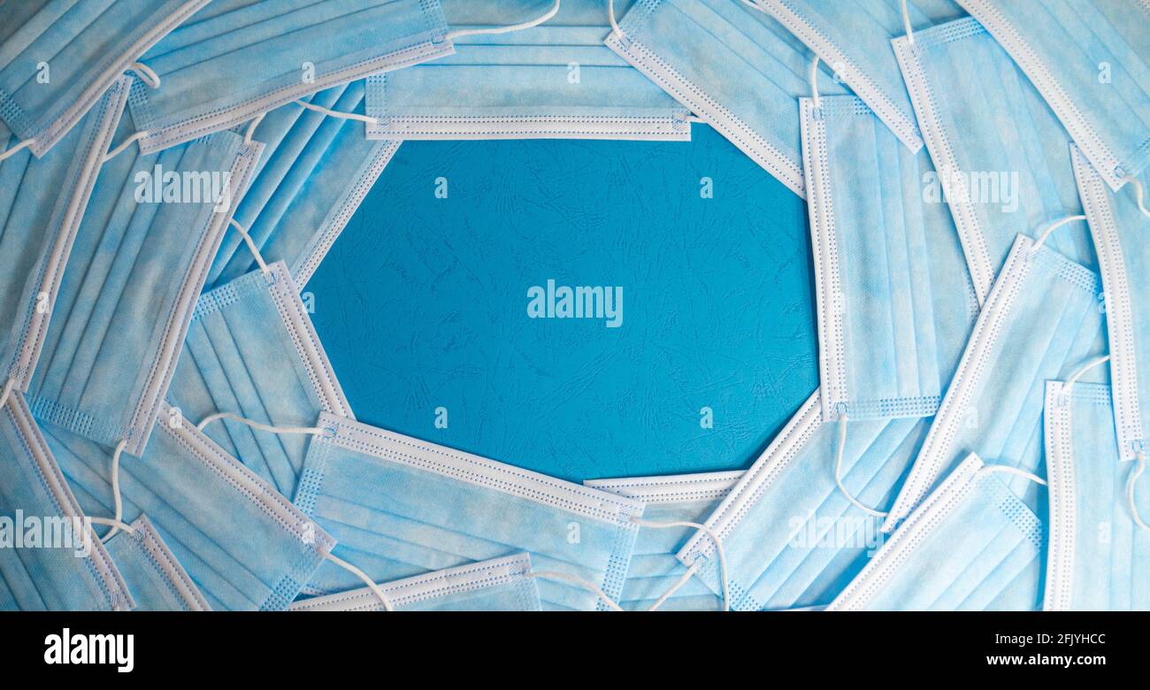 Layout made of medical masks with paper card note for text Stock Photo ...