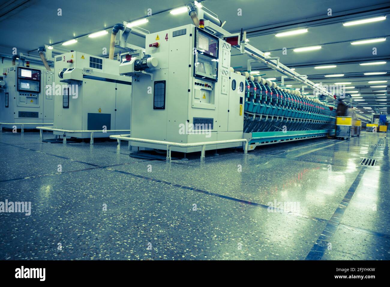 Auto Coner in Textile Spinning unit Stock Photo - Alamy